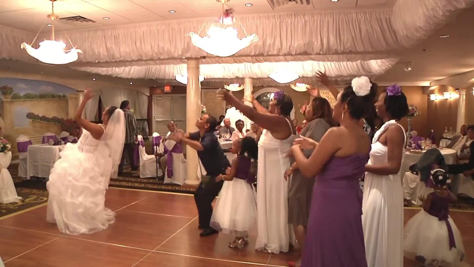 Woman Falls While Grabbing Bouquet at Wedding | Jukin Media Inc