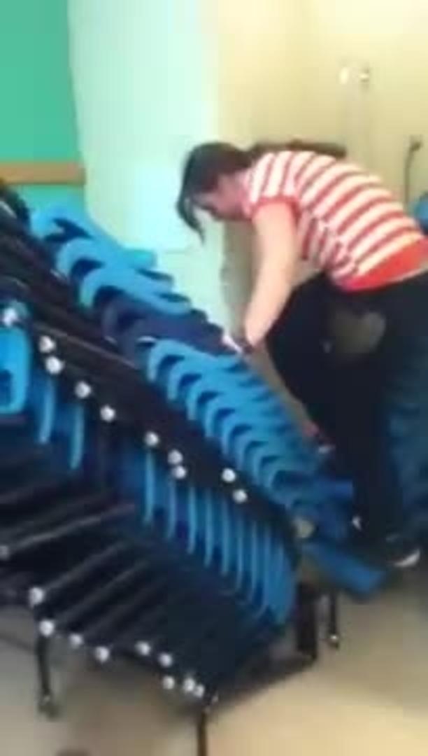 Girl Tries to Climb Stack of Chairs and Falls | Jukin Licensing