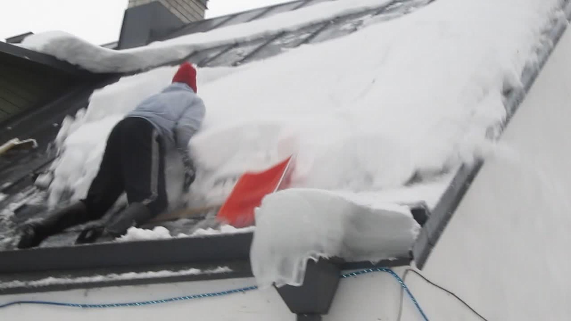 Guy Falls off Roof Trying to Shovel off Snow | Jukin Media Inc