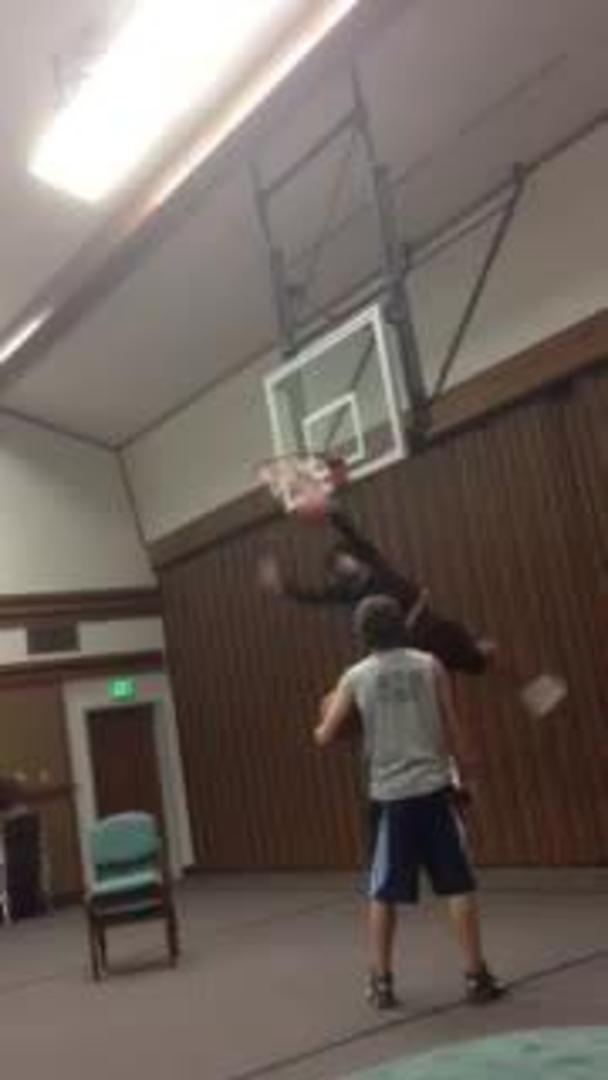 Man Falls After Dunking Ball in Basketball Hoop Standing on Car's Roof ...