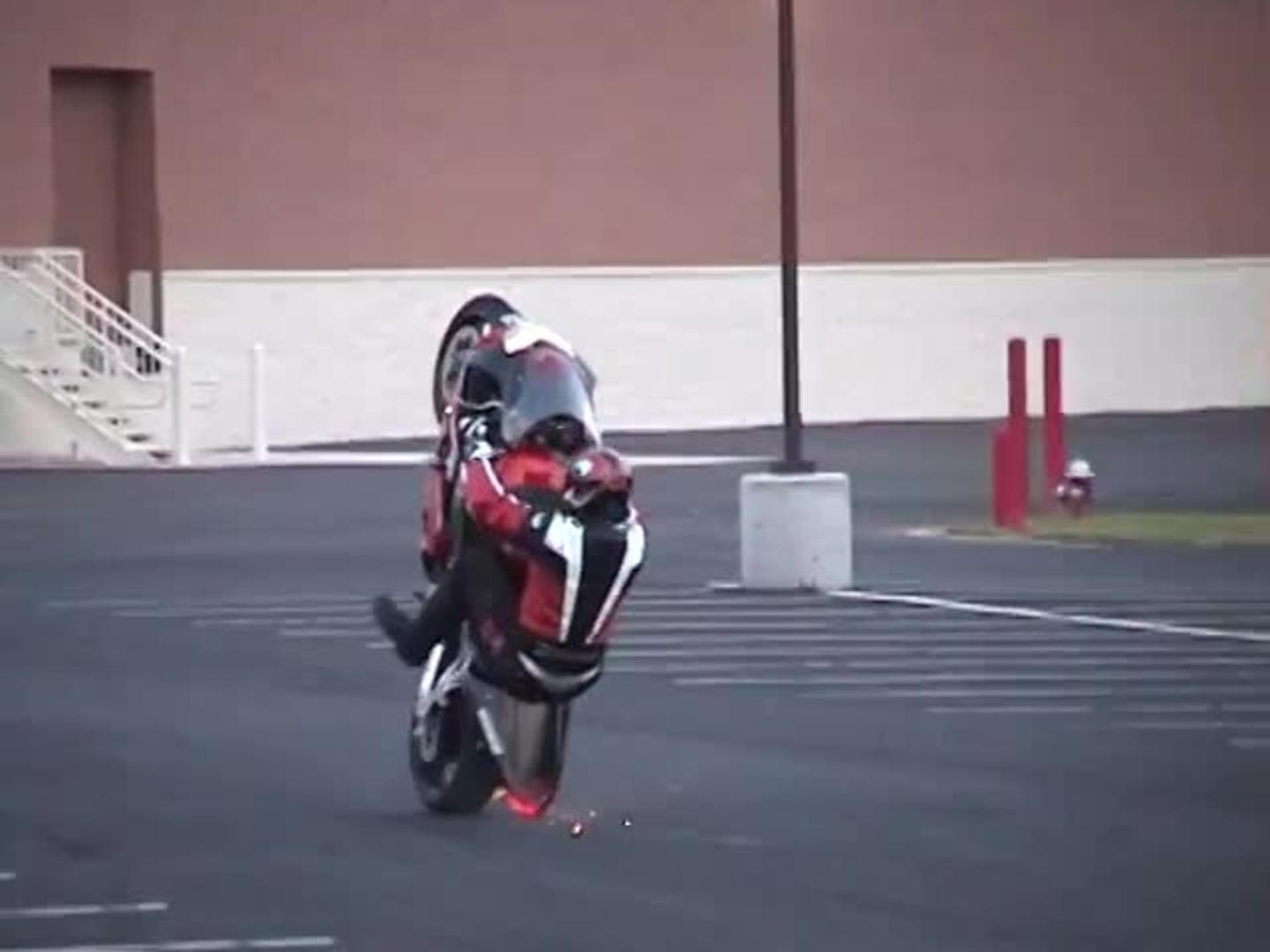 Bike Spins On Ground As Biker Falls Doing Wheelie | Jukin Media Inc