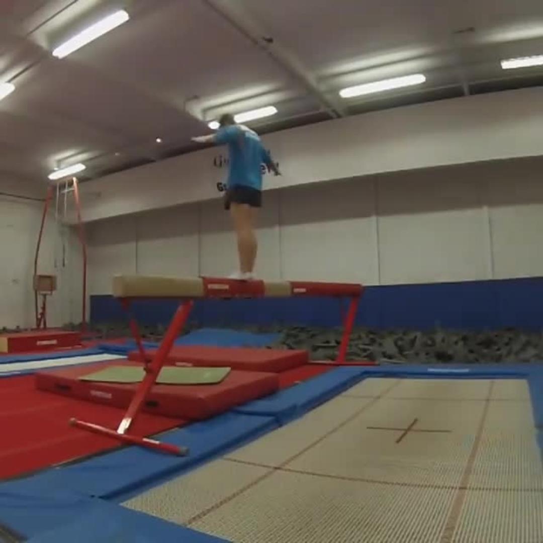 Guy Does Handstand on Beam after Bouncing on Trampoline | Jukin Licensing
