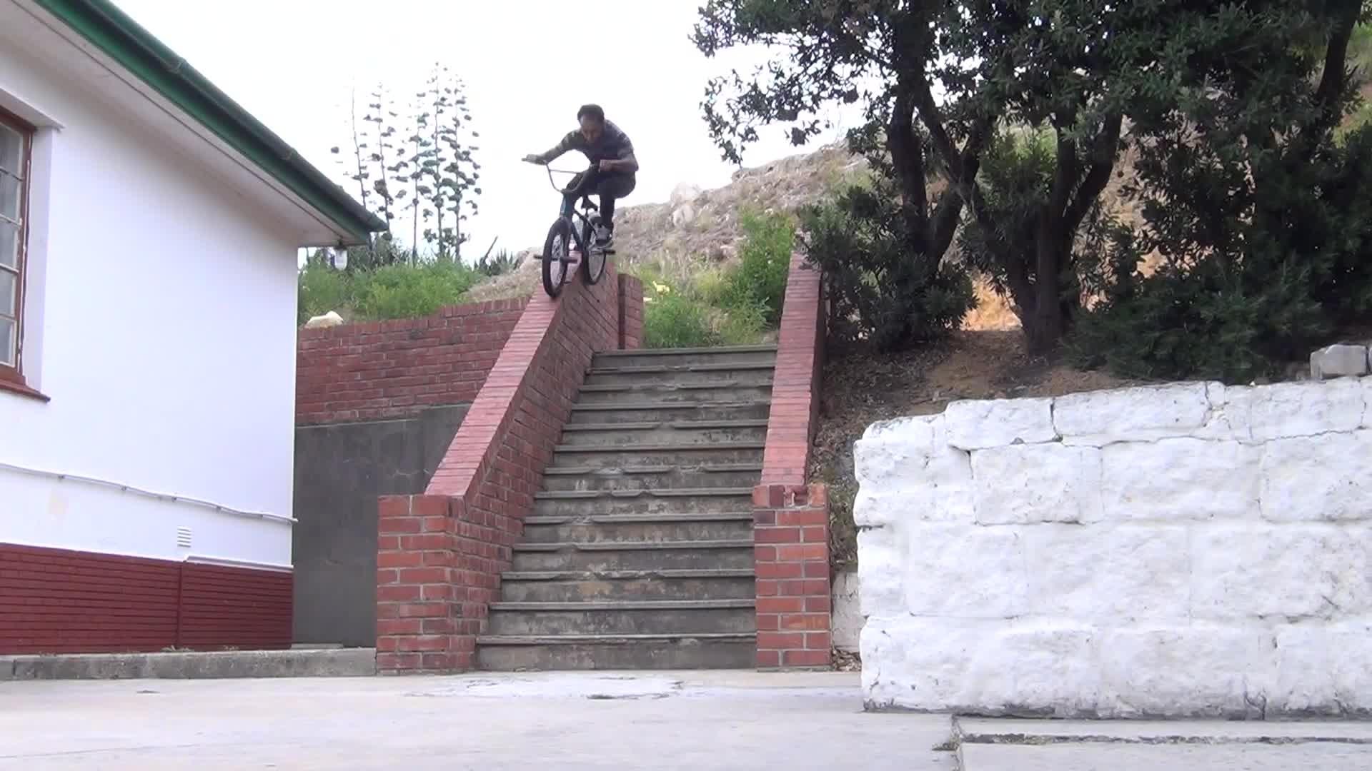 BMX Rider Faceplants on Rail near Church | Jukin Media Inc