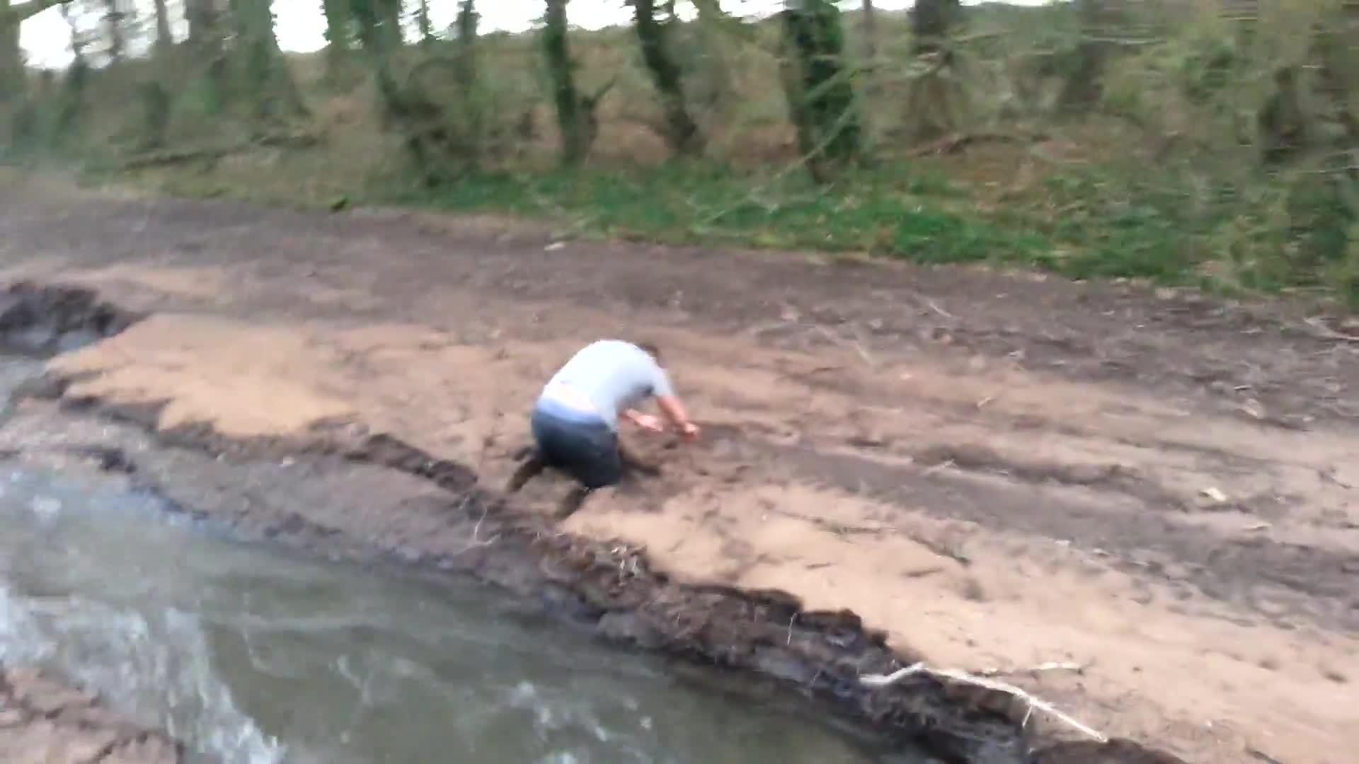 Guy Gets Stuck in Mud Jumping over River | Jukin Licensing