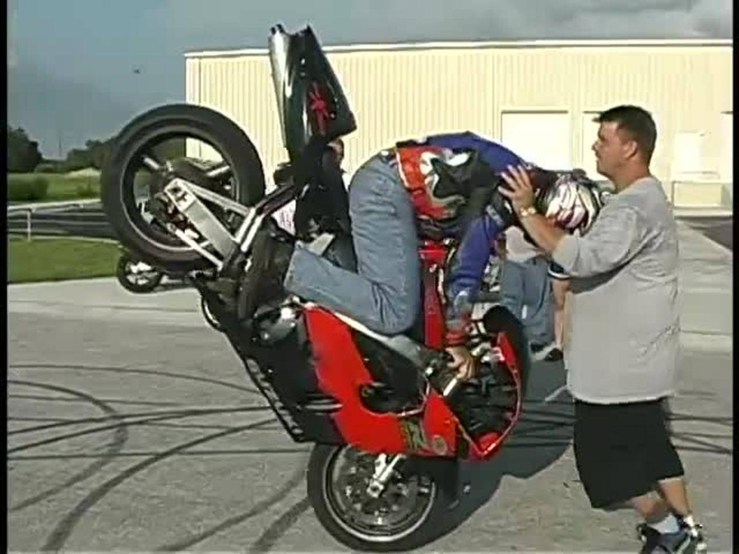 Motorcycle Stoppie in Front of Topless Biker Girls | Jukin Media Inc