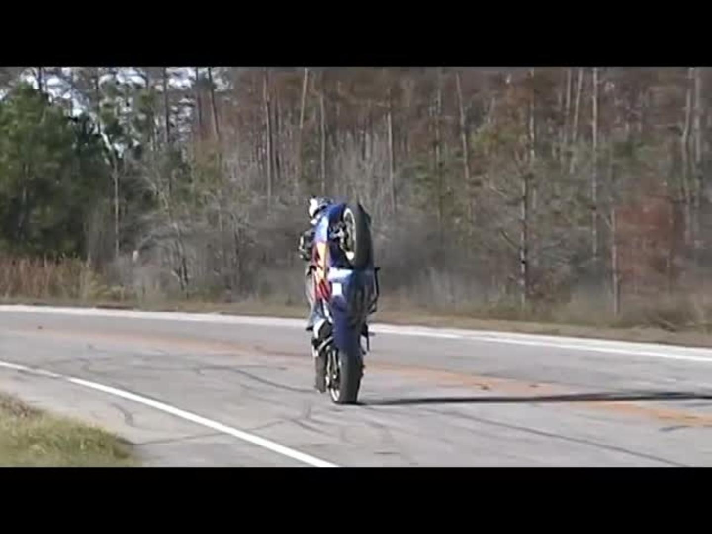 Biker Doing Standing Wheelie Flips Motorcycle | Jukin Licensing