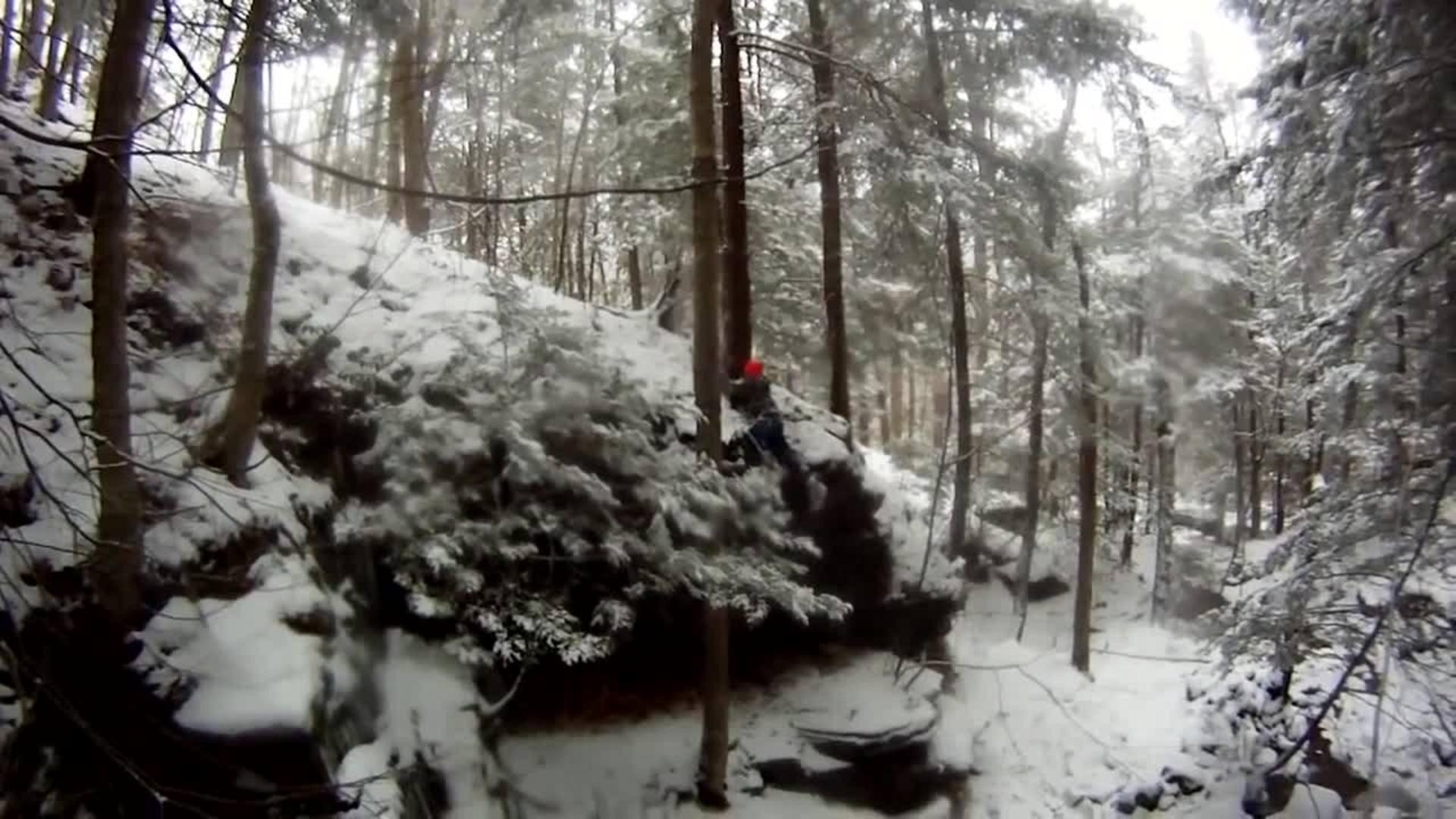 Drop off Snowy Cliff into Frozen Water | Jukin Licensing