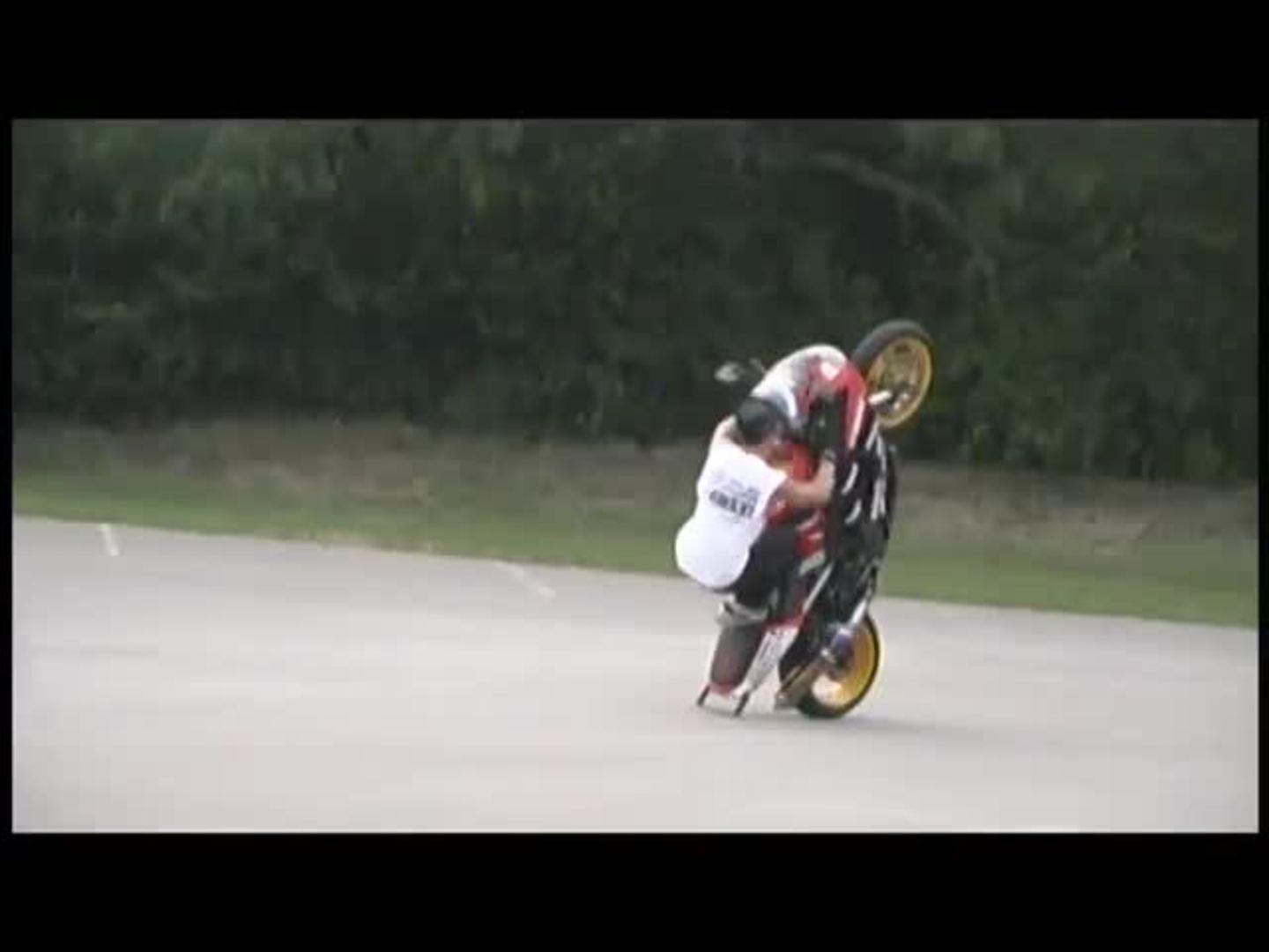 Motorcyclist Attempts Wheelie on Highway and Crashes | Jukin Media Inc