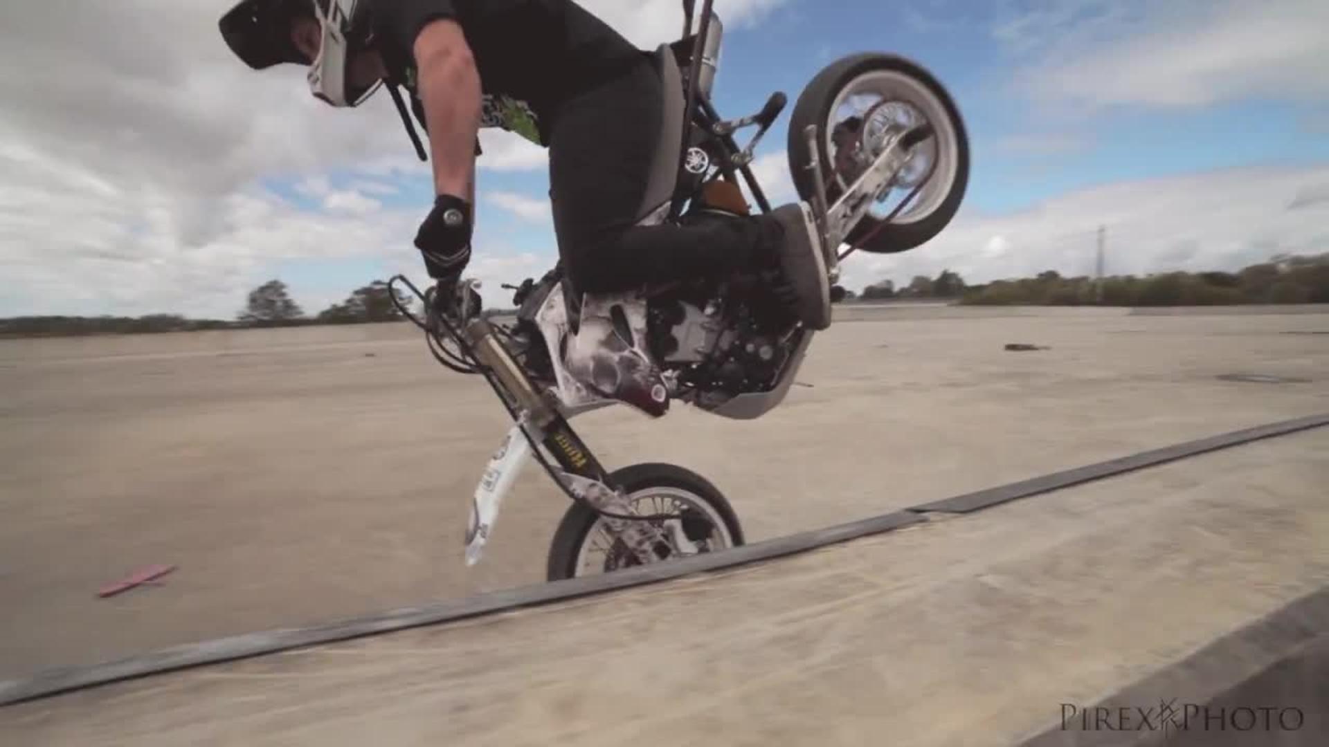 Motorcycle Stoppie Ends With Faceplant | Jukin Media Inc