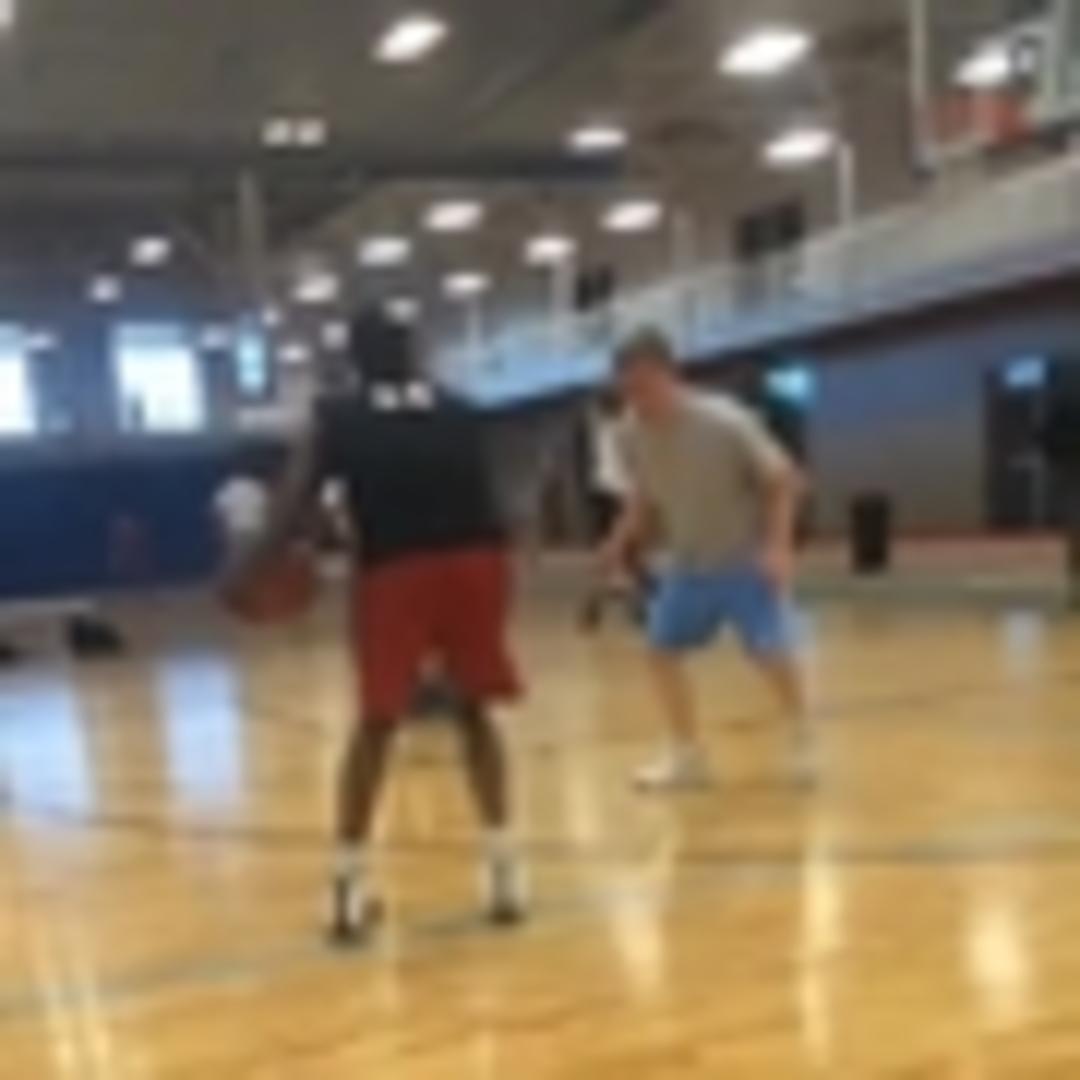 Basketball Player Makes Defender Fall to Floor | Jukin Licensing