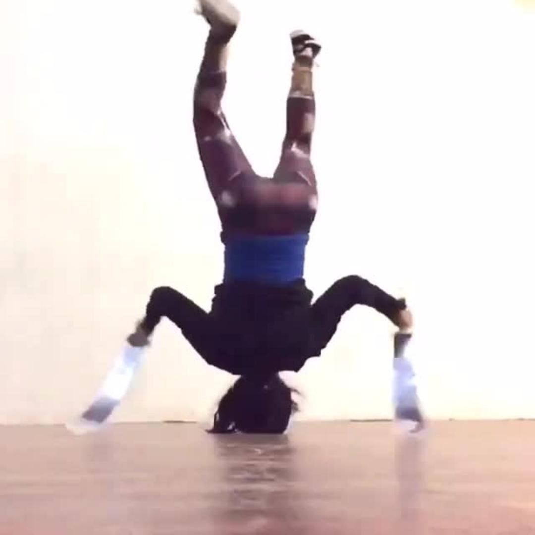 Breakdancer Spins on Head in Front of Crowd on Street | Jukin Media Inc