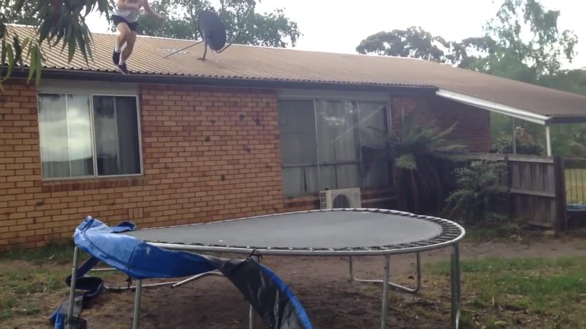 Guy Breaks Trampoline Jumping off Roof | Jukin Media Inc