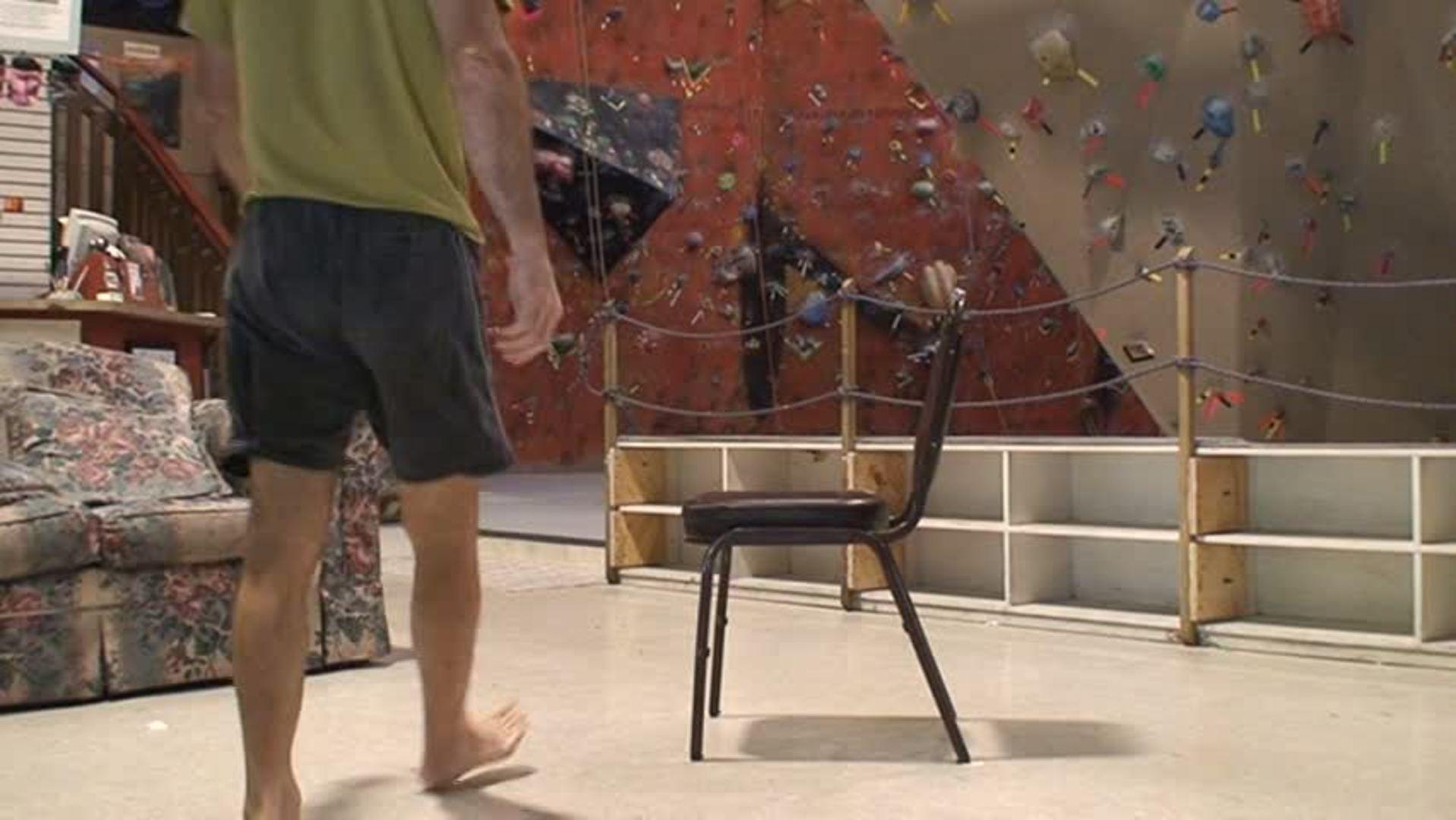 Guy Twists Himself around Chair | Jukin Licensing