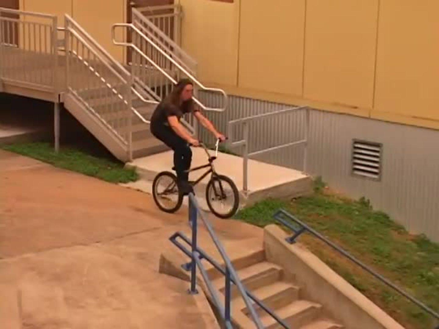 Long Haired BMX Rider Falls during Rail Grind | Jukin Licensing