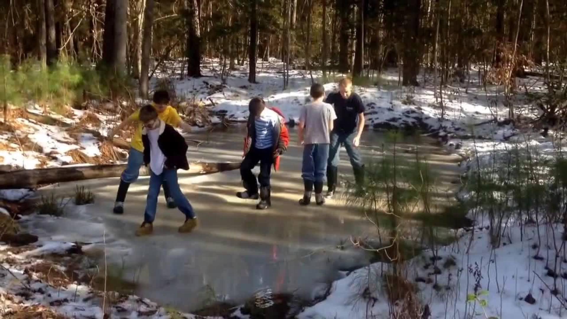 Boys Slide around on Icy Pond | Jukin Licensing