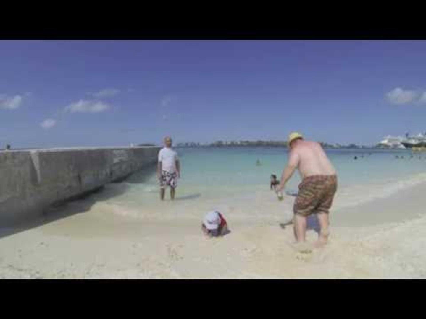 Girl in Bikini Falls at Beach | Jukin Media Inc