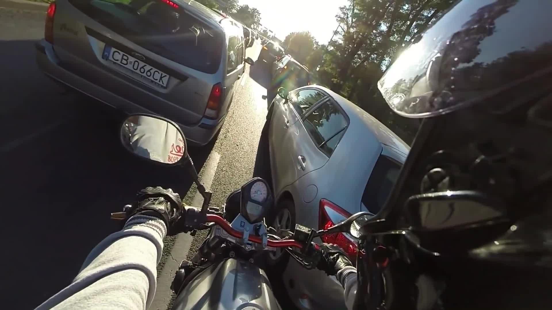 Motorcycle Hits Car Stopped in Intersection | Jukin Media Inc