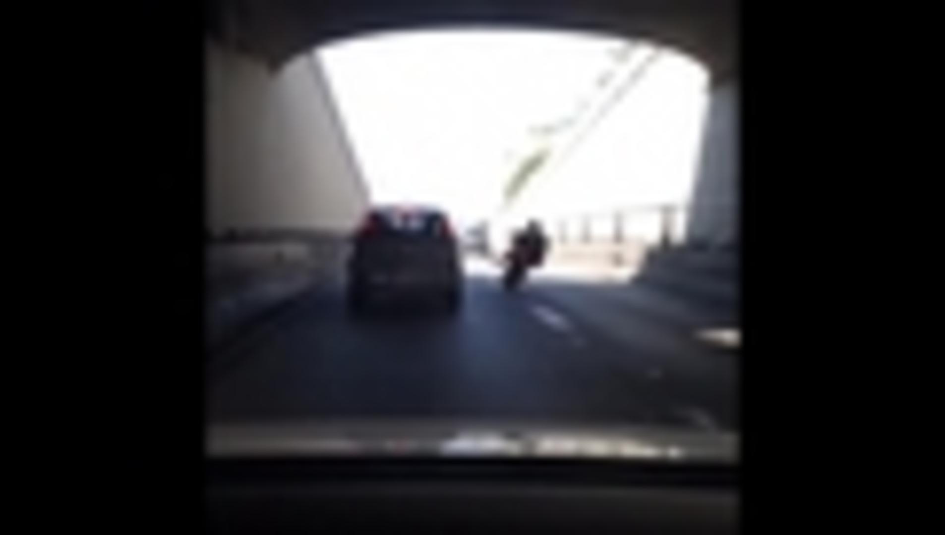 Motorcyclist Falls Trying to Kick Car | Jukin Licensing