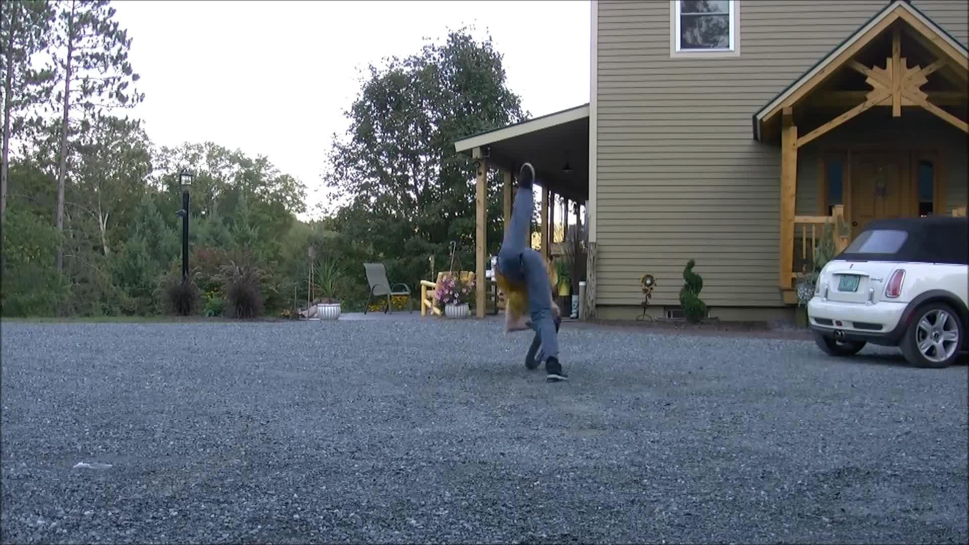 Unicycle Rider Fails at Flip Trick in Driveway | Jukin Licensing