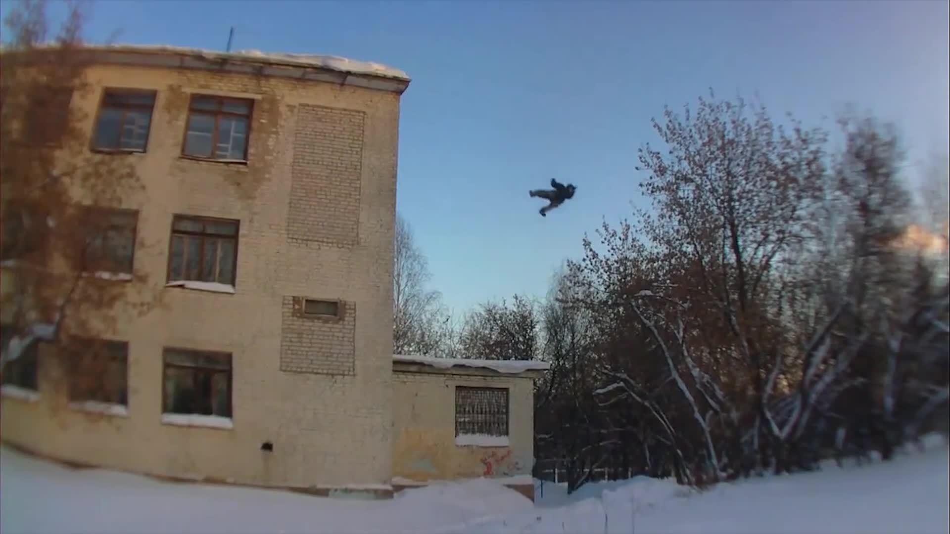 Daredevil Jumps Off Building into Snow Bank | Jukin Media Inc