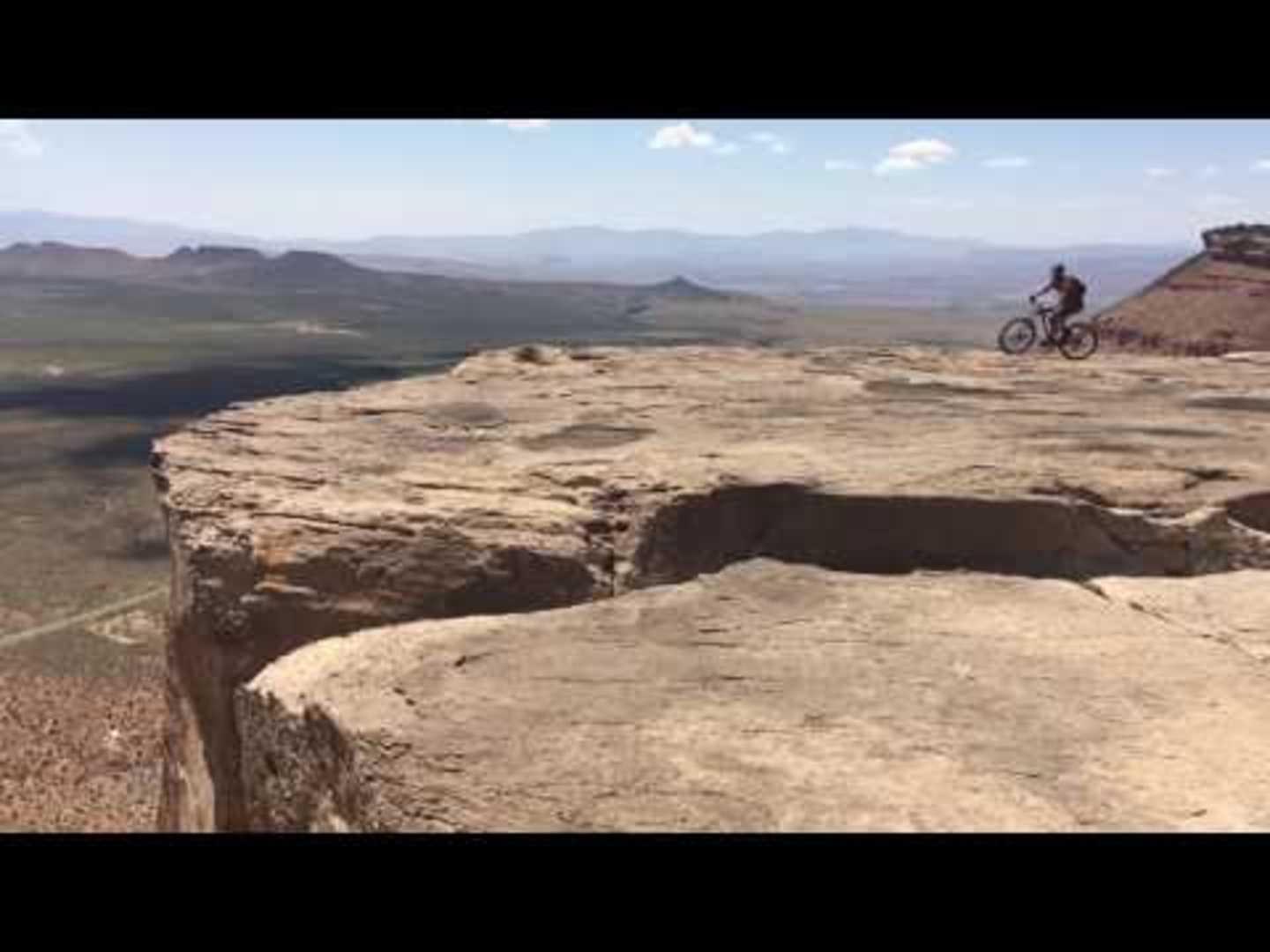 Rocks Fall off Cliff after Hiker Takes Leap of Faith | Jukin Media Inc