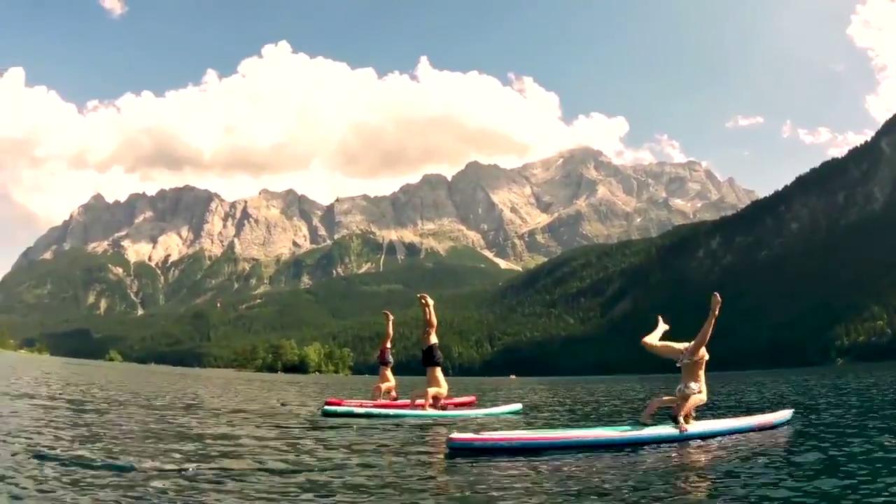 Yogis Handstand on Paddle Boards and Fall | Jukin Licensing