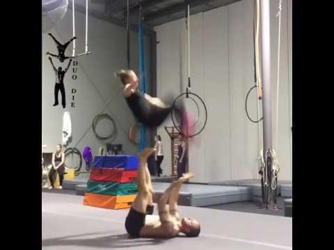 Acrobat Does Flip from Sitting on Partner's Feet | Jukin Licensing