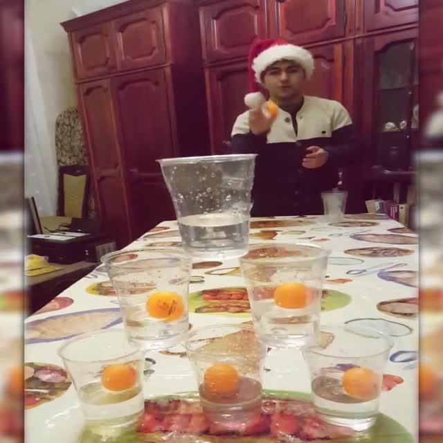 Guy Shoots Ping Pong Balls Into Water Cup Pyramid | Jukin Licensing