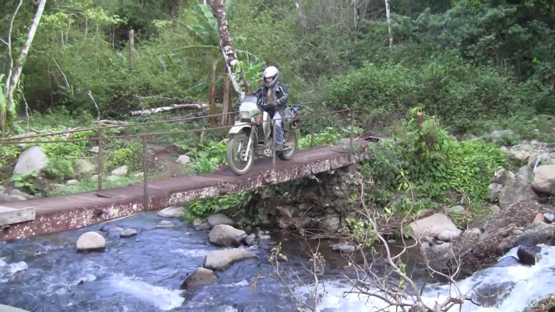 Guy Crossing River on Dirt Bike Falls Off | Jukin Media Inc