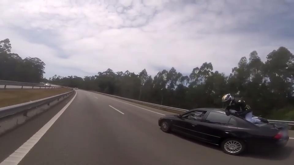 Motorcycle Attempts to Outrun Car and Crashes | Jukin Media Inc