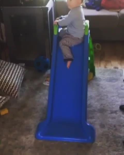 Dad Saves Kid from Falling off Slide | Jukin Licensing