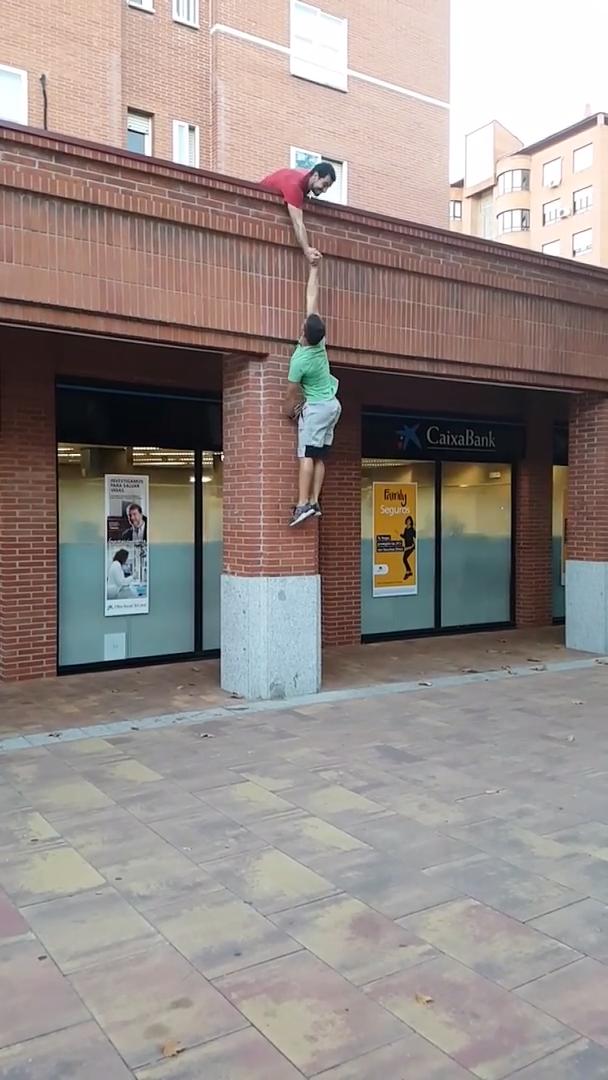 Guys Jump Up on Roof in Cooperative Stunt | Jukin Licensing