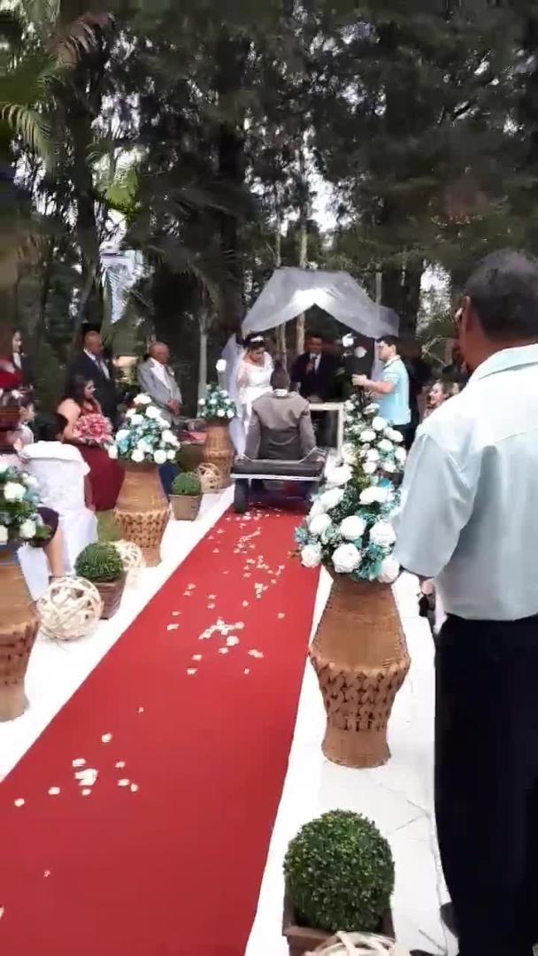 Bride Pulls Chained Up Groom Down Aisle on Cart | Jukin Licensing