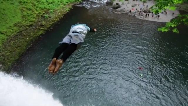 Guy Jumps on Friend in Waterfall Pond | Jukin Media Inc