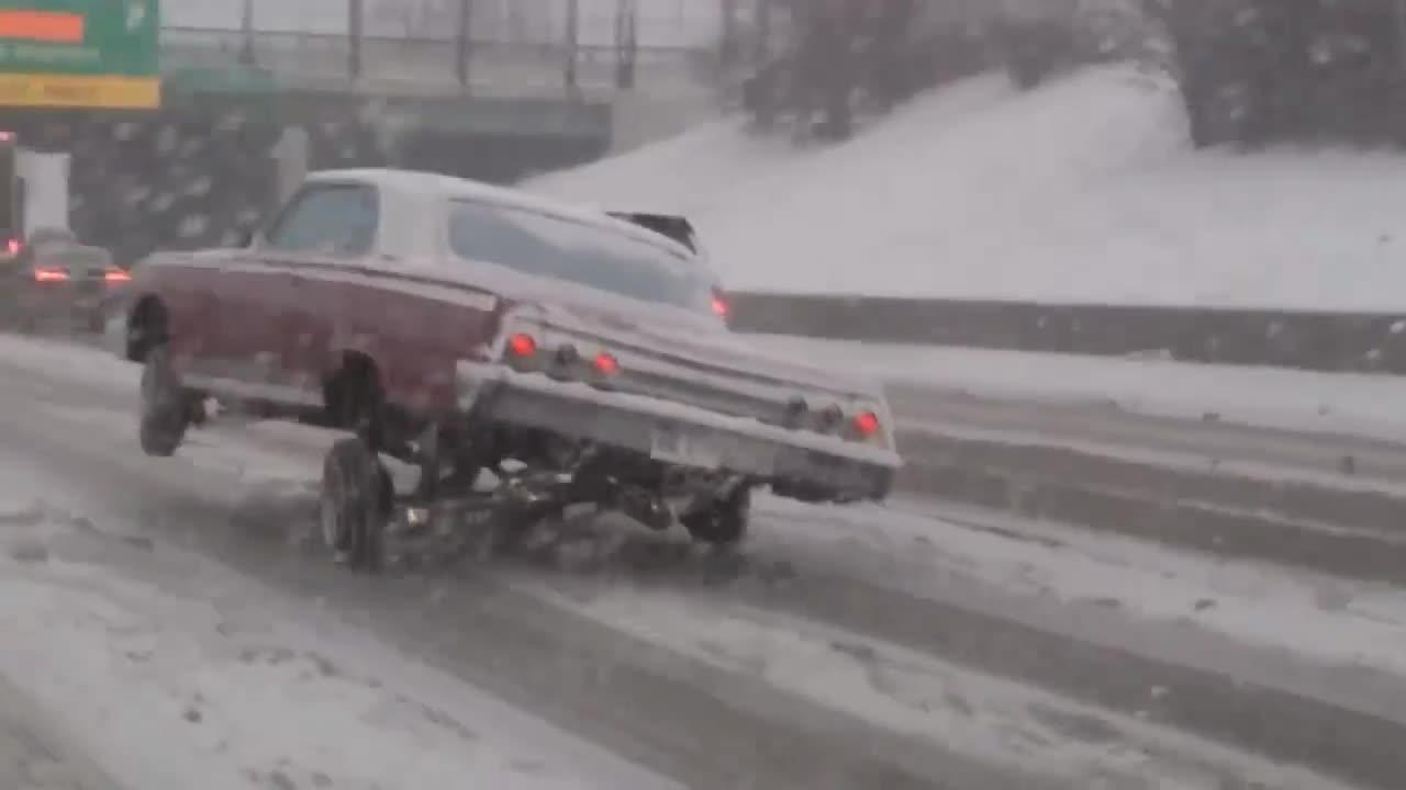 Lowrider Does 3 Wheel Motion on Freeway | Jukin Media Inc
