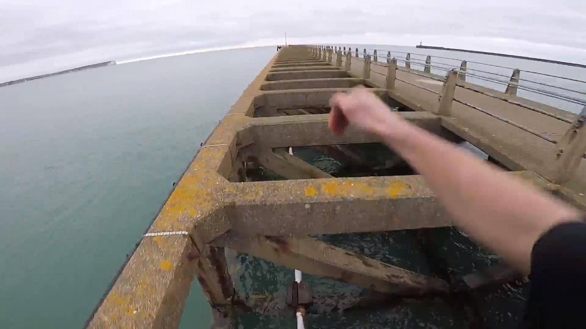 Guy Runs Across Beams on Long Pier | Jukin Media Inc