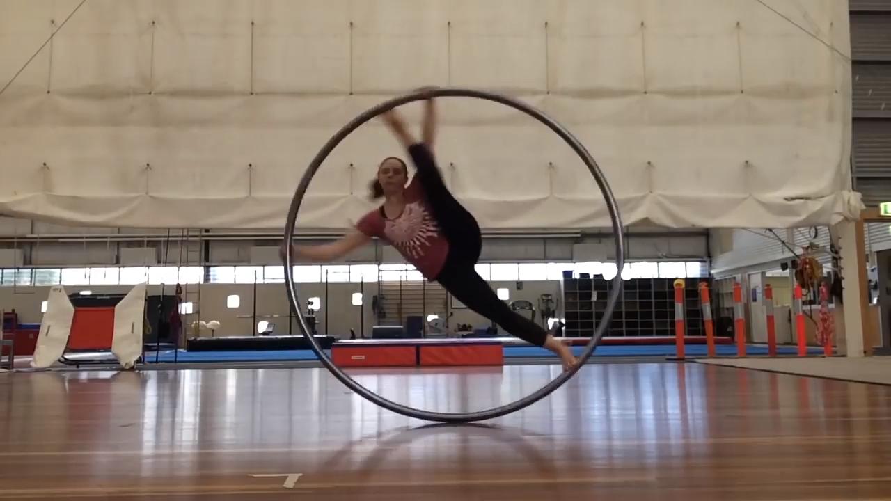 Acrobat Performs Spinning Dance on Cyr Wheel | Jukin Licensing
