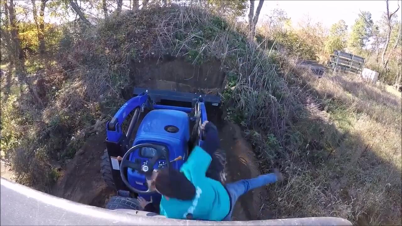 Guy Falls Down and Faceplants Into Wheel of Tractor | Jukin Licensing