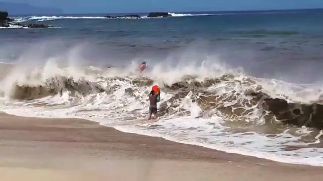 Surfer Gets Knocked Over by Strong Wave | Jukin Media Inc
