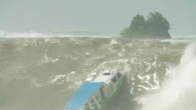 Boat Gets Crushed by Enormous Wave and Tips Over | Jukin Media Inc