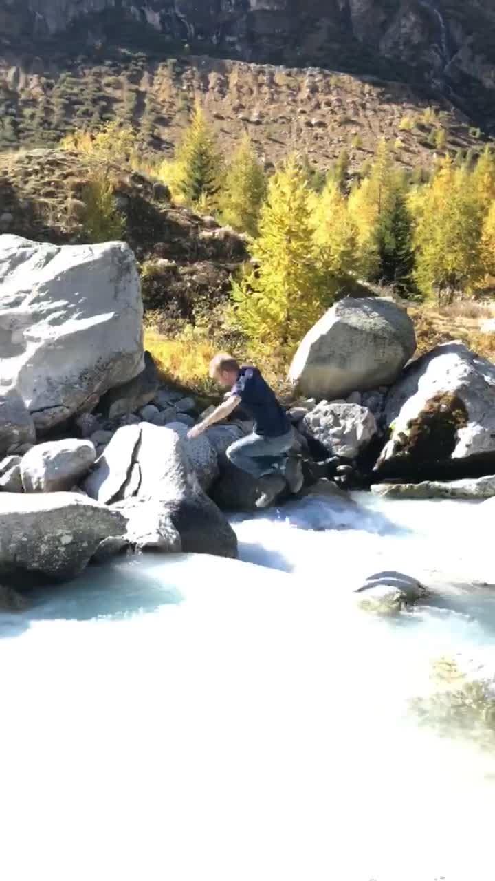 Guy Slips on Wet Rock and Falls into River While Fishing | Jukin Media Inc