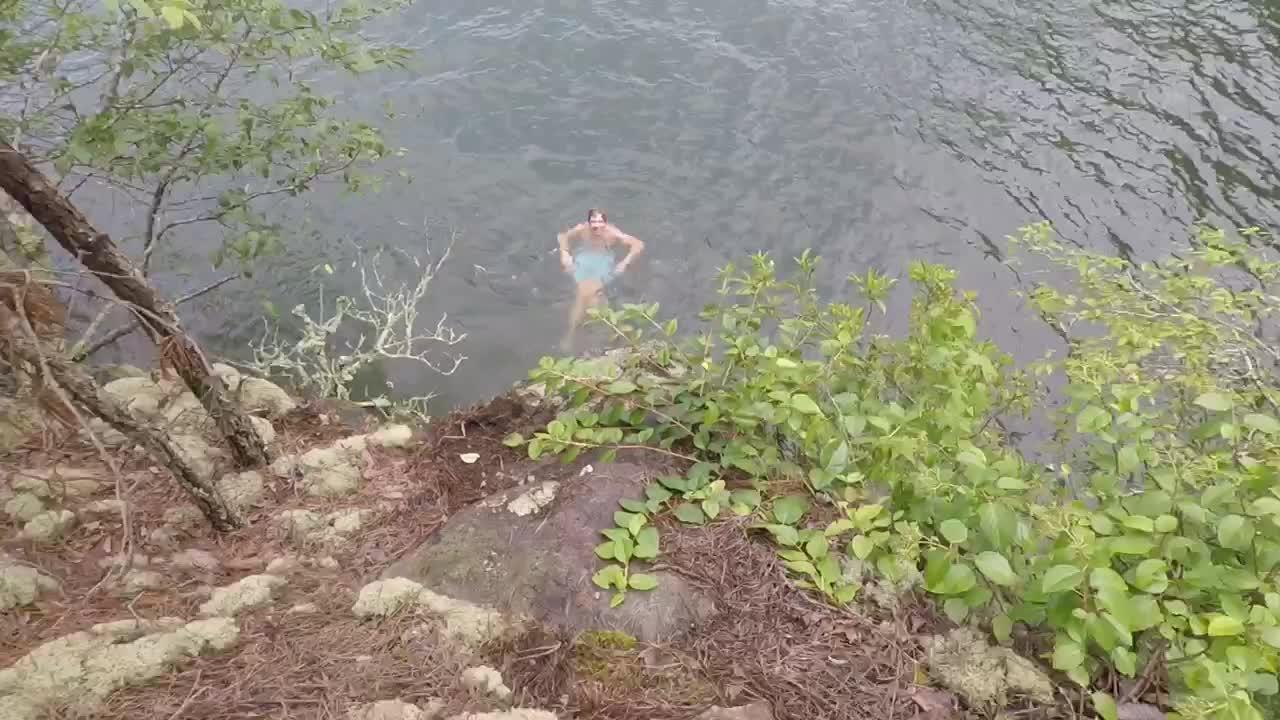 Boy Slips Off Cliff and Falls into Lake | Jukin Licensing