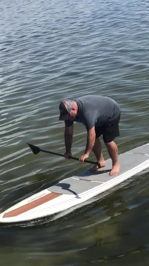Guy Falls Off Paddle Board and Lands On His Crotch | Jukin Media Inc
