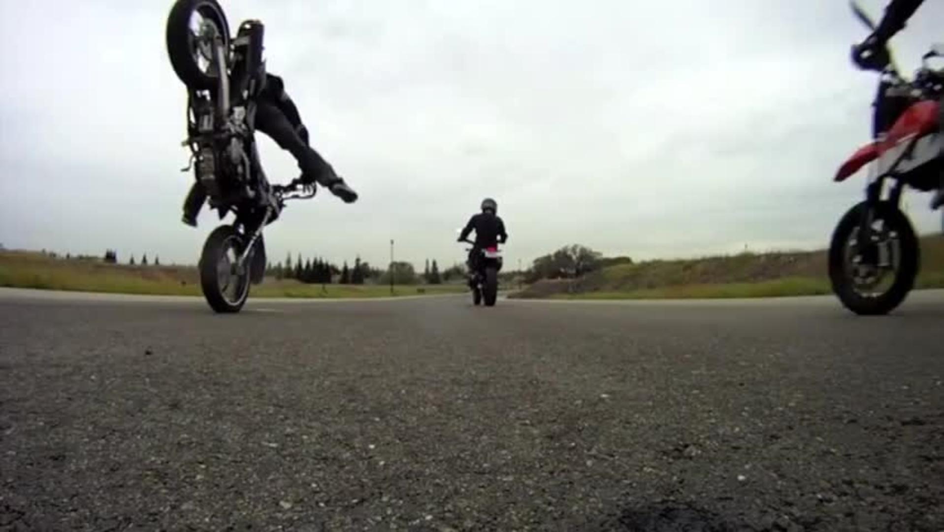 Motorcycle Stoppie in Front of Topless Biker Girls | Jukin Media Inc