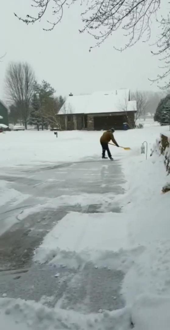 Man Skates While Shoveling Snow on Frozen Driveway | Jukin Licensing