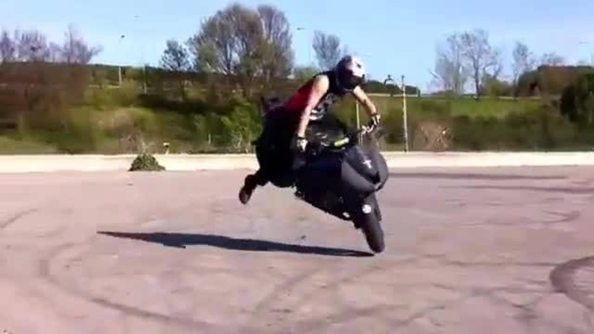 Motorcycle Rider Falls Forward during Stoppie Stunt | Jukin Media Inc