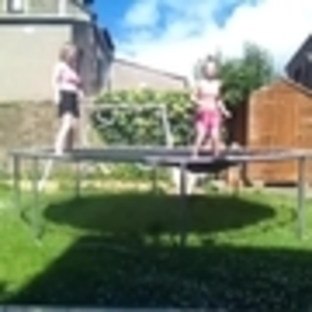 Girl's Dress Gets Stuck to Branch as She Jumps off Tree Onto Trampoline ...