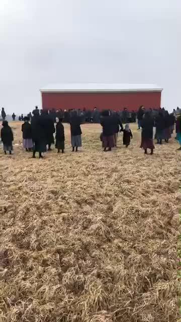 Large Crowd of Amish People Lift and Move Barn | Jukin Licensing