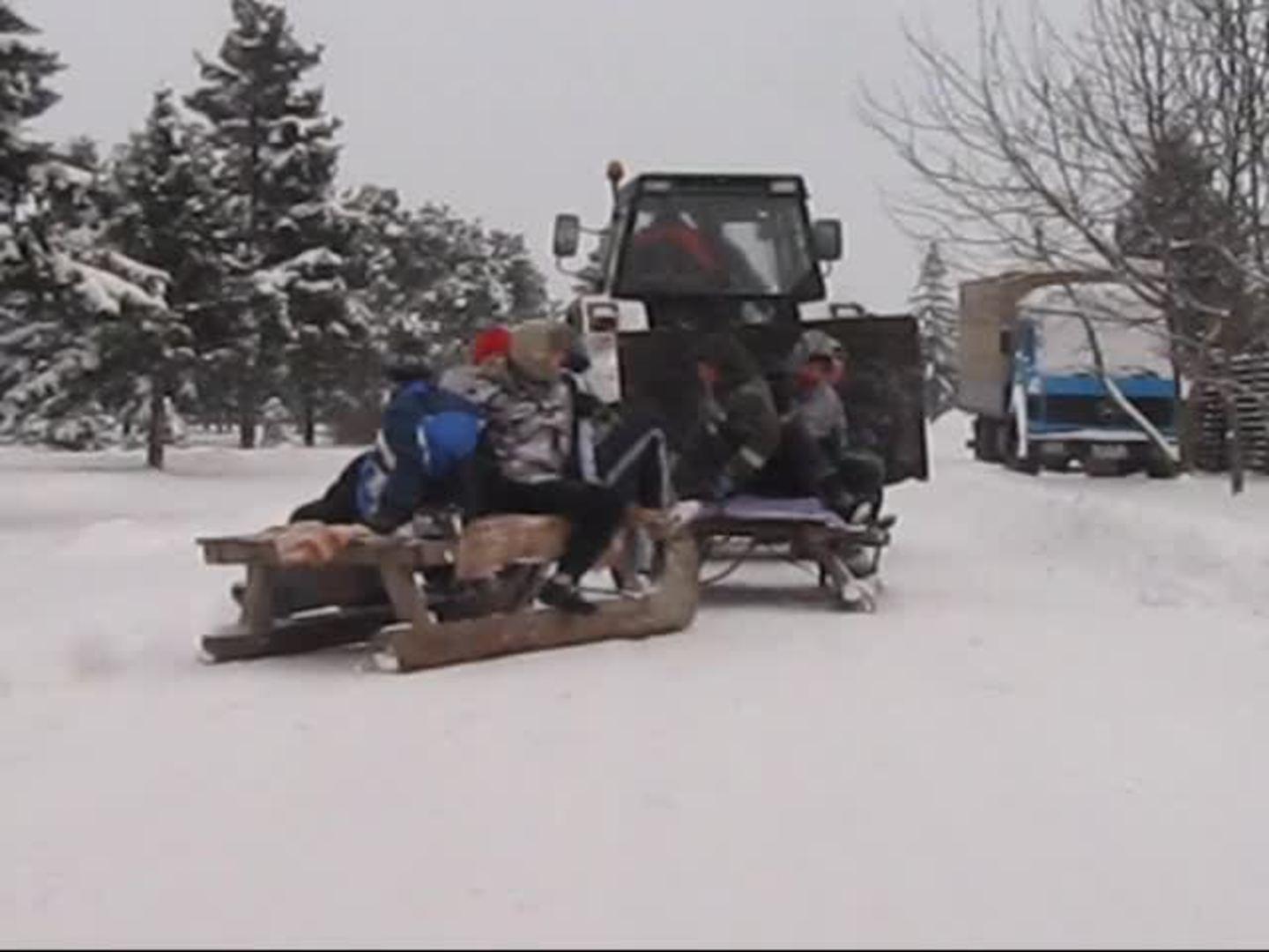 Friends Enjoy Snow Day and Go Sled-Skitching | Jukin Licensing