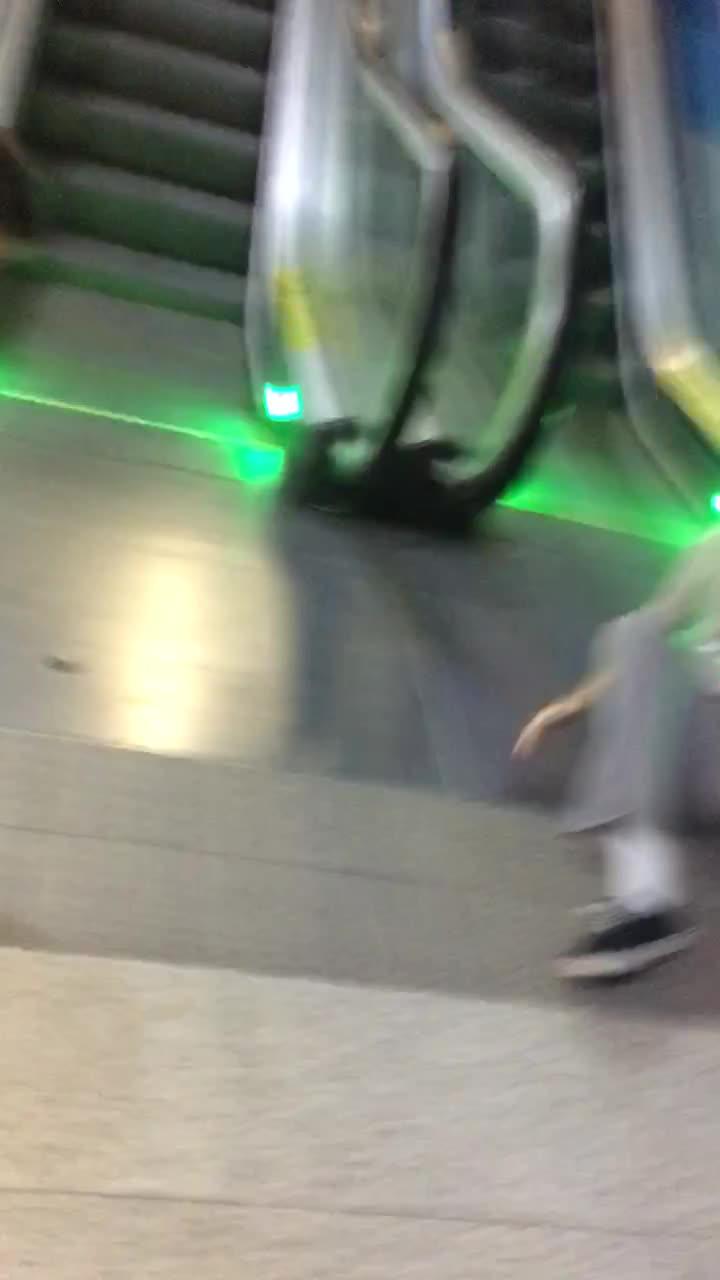 Guy Falls on Neck Attempting to Ride Escalator Railing Lying Down ...